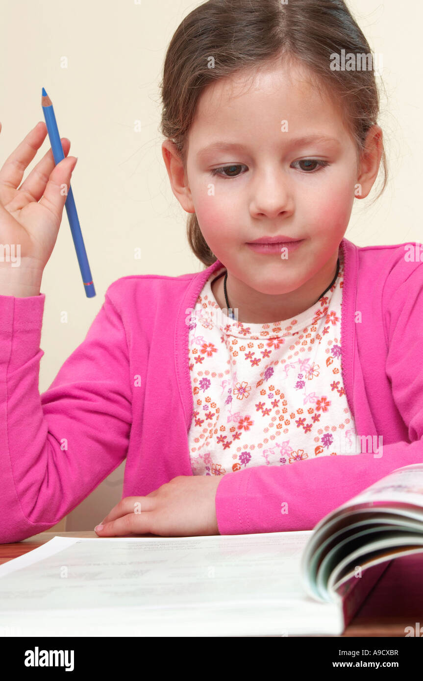 portrait of young girl doing her homework Stock Photo - Alamy