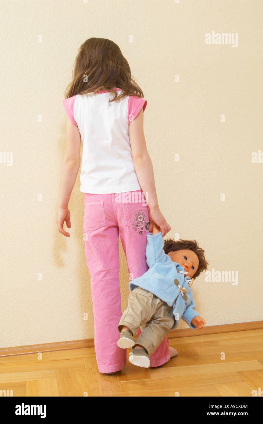 rear view of young girl holding doll Stock Photo - Alamy rear view of young girl holding doll Stock Photo - Alamy