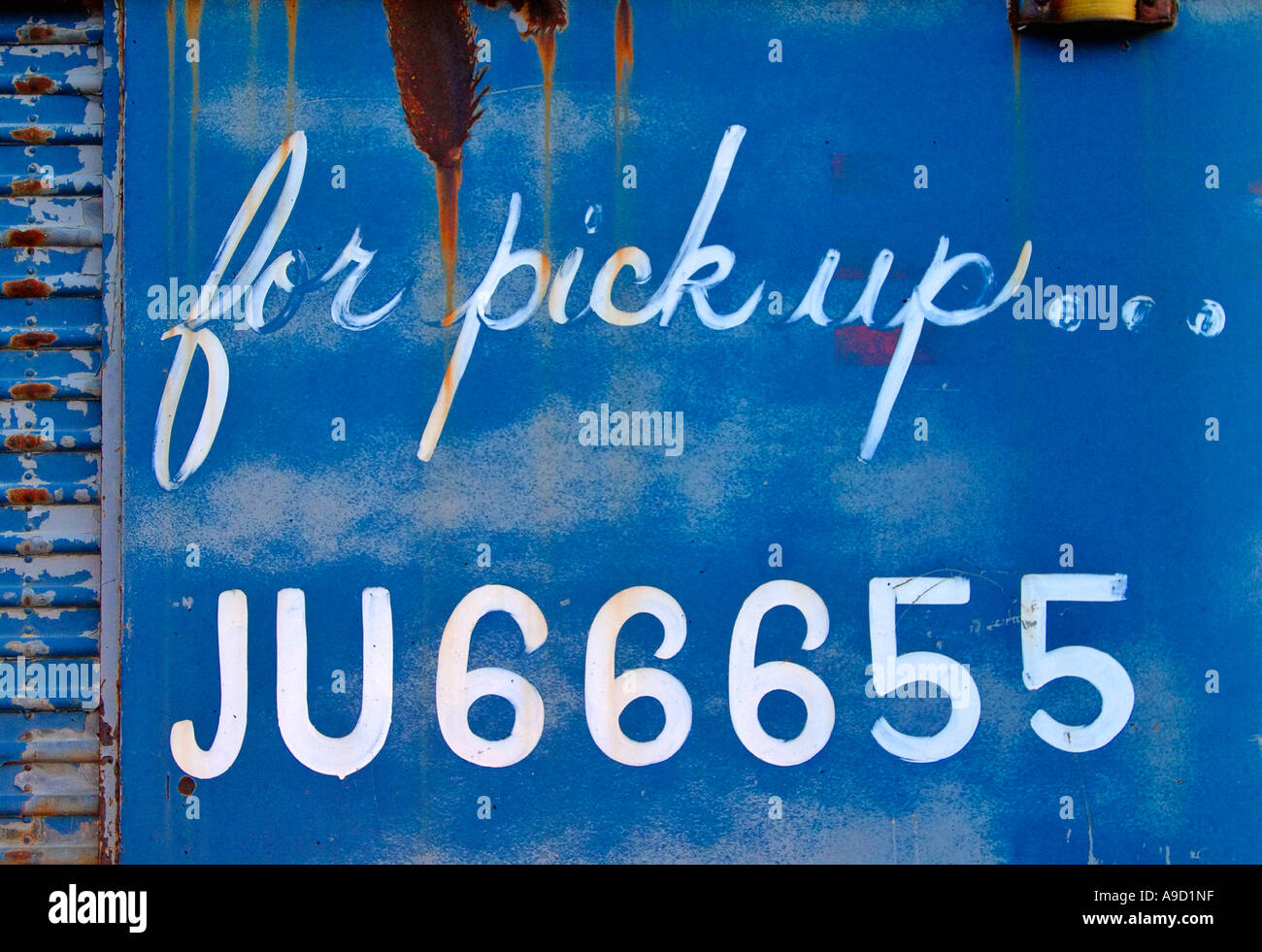 An old blue sign Stock Photo - Alamy