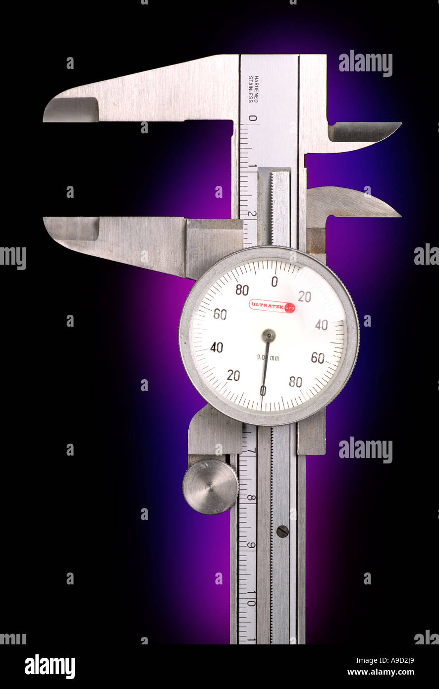 Vernier caliper black blue purple background Stock Photo - Alamy