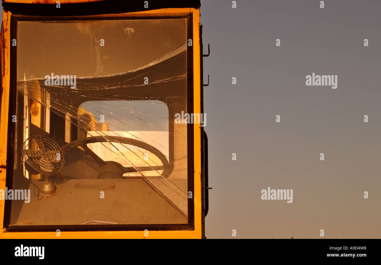 Broken window on a heavy equipment cab Stock Photo - Alamy