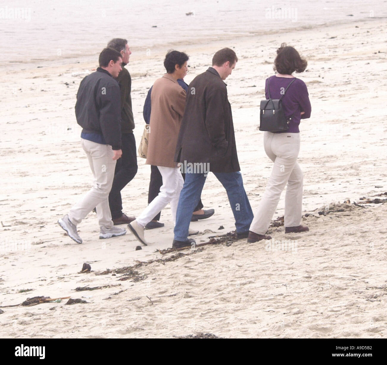 france larmour plage brittany family walking along beach Stock Photo ...