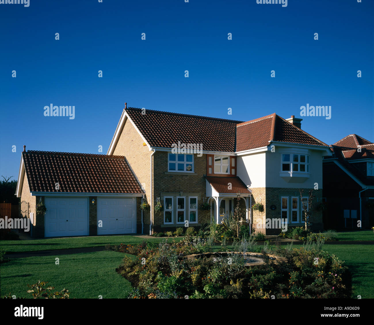 New detached brick executive house with pitched roof and double garage ...