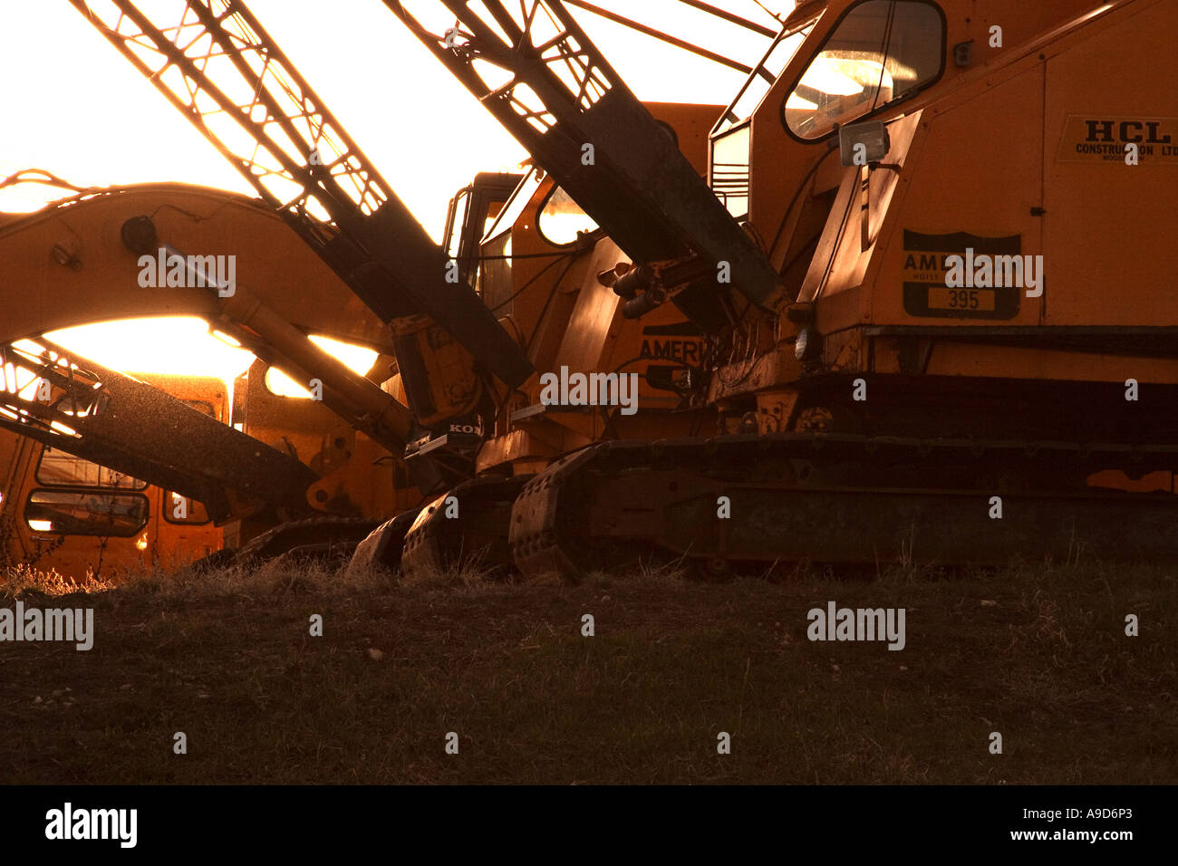 Setting sun lighting up three cranes in scenic Saskatchewan Canada ...