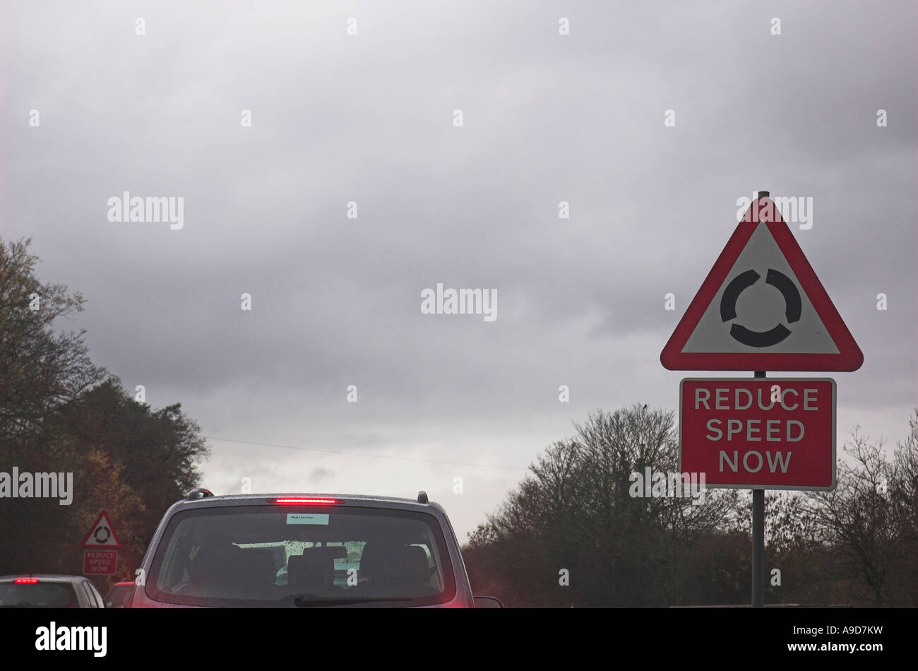Cars approaching a roundabout in the United Kingdom Stock Photo - Alamy