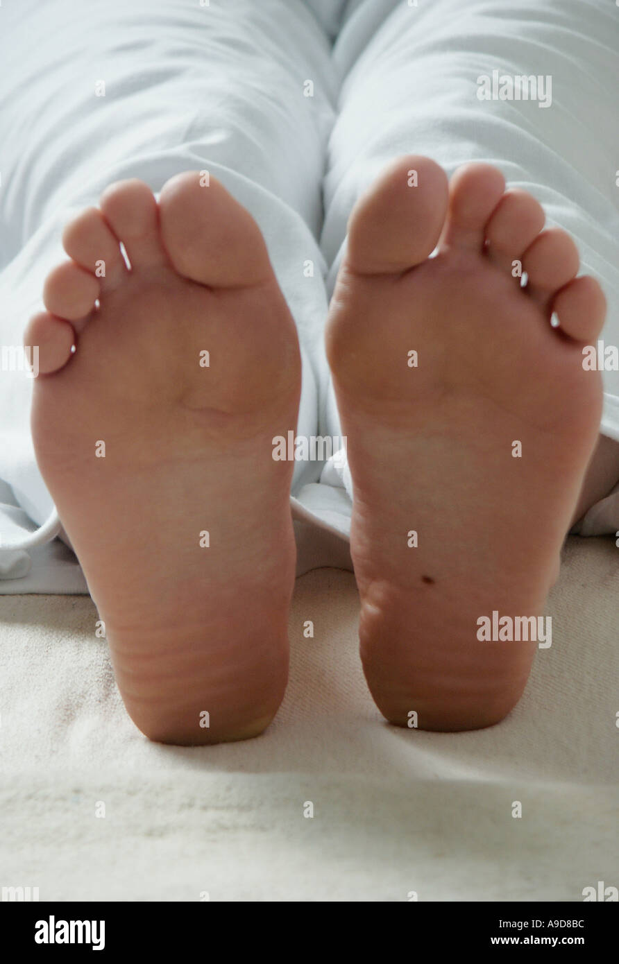 Soles of two feet Stock Photo - Alamy