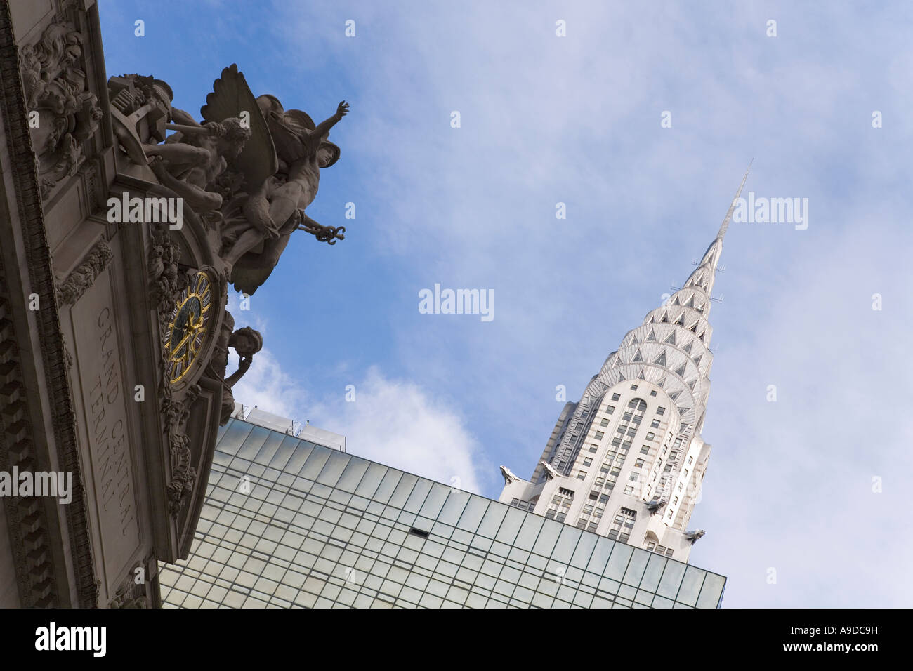 Grand Central Station Clock, skyscraper and Chrysler Building in sun ...
