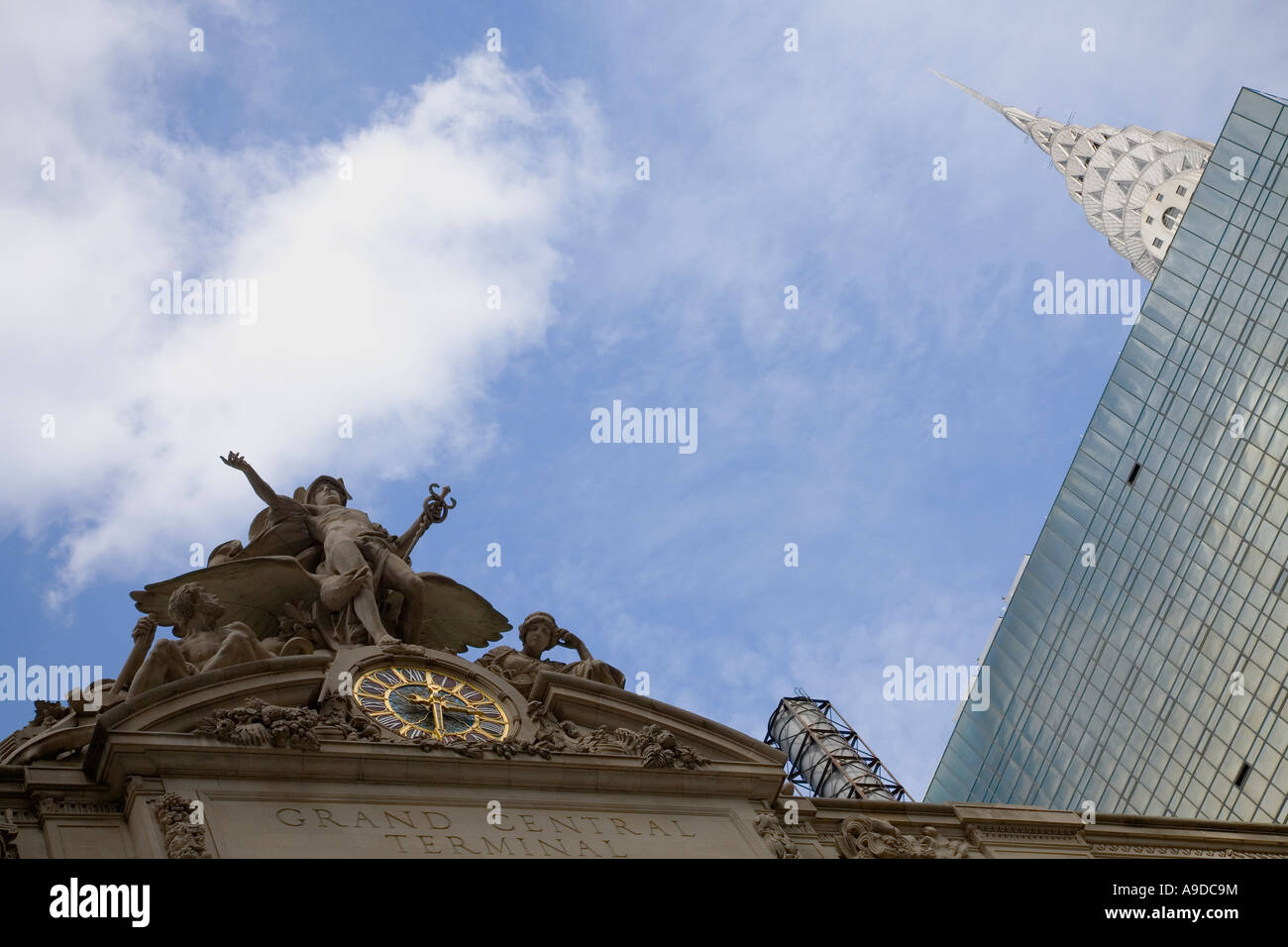 Grand Central Station Clock, skyscraper and Chrysler Building in sun ...
