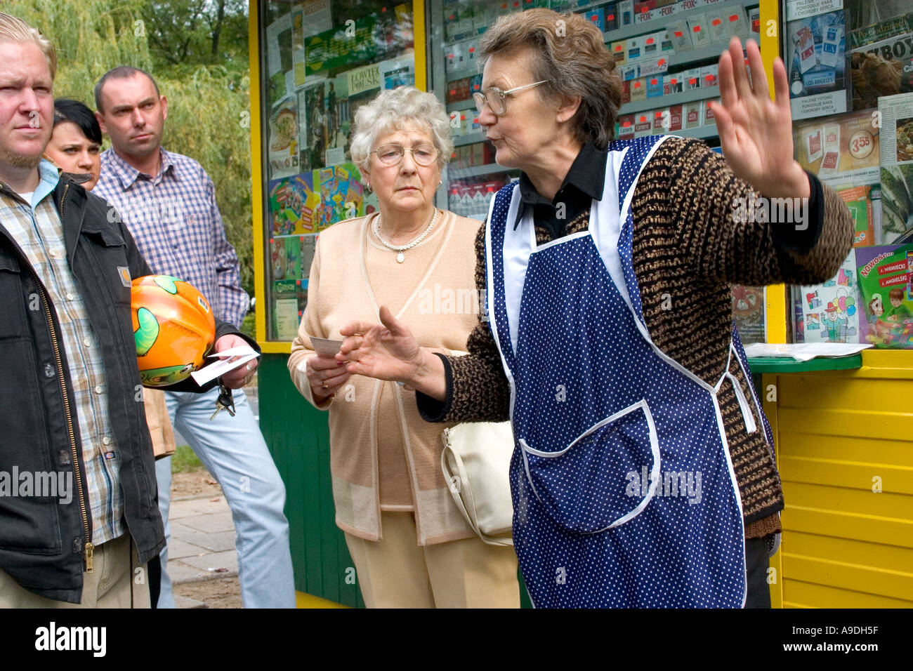 Polish shopkeeper giving directions to visitors. Spala Poland Stock ...