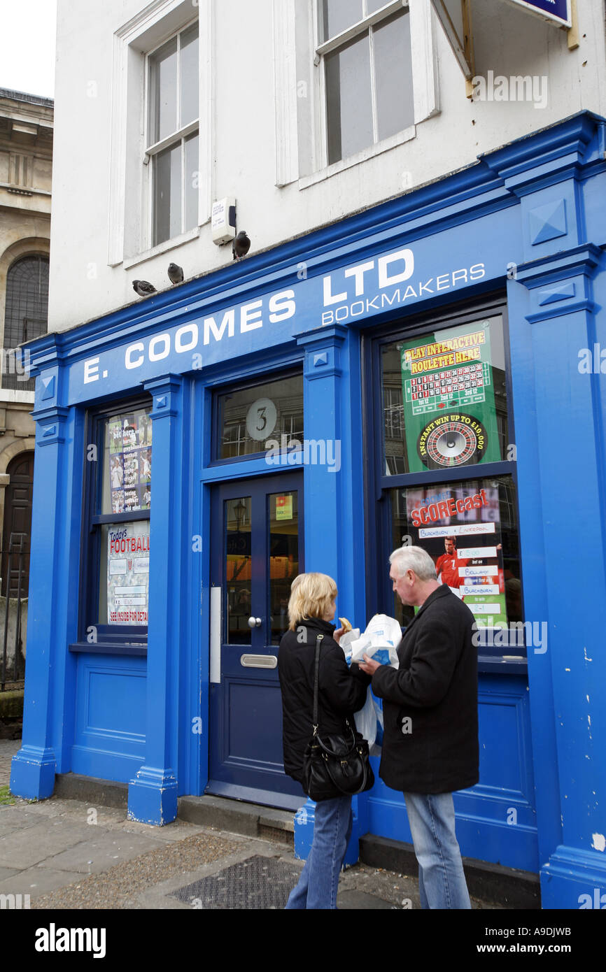 united kingdom london greenwich a couple outside e coomes bookmakers ...