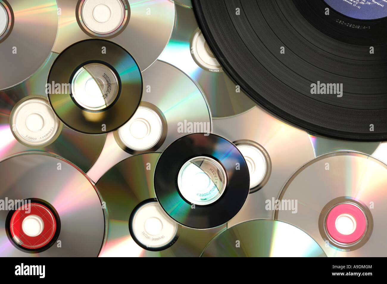 Compact disks DVDs CDs and a Vinyl Stock Photo - Alamy