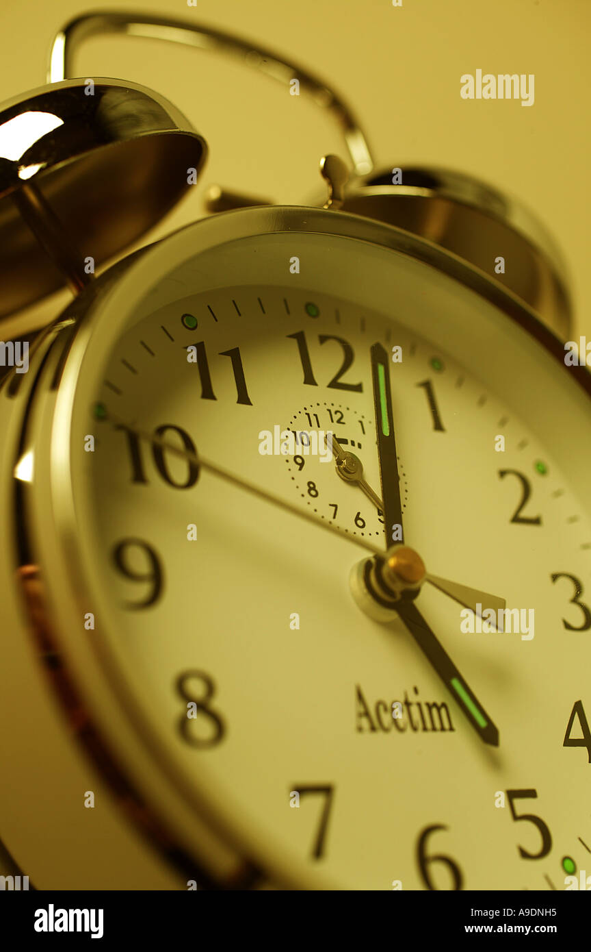 Yellow alarm clock Stock Photo - Alamy