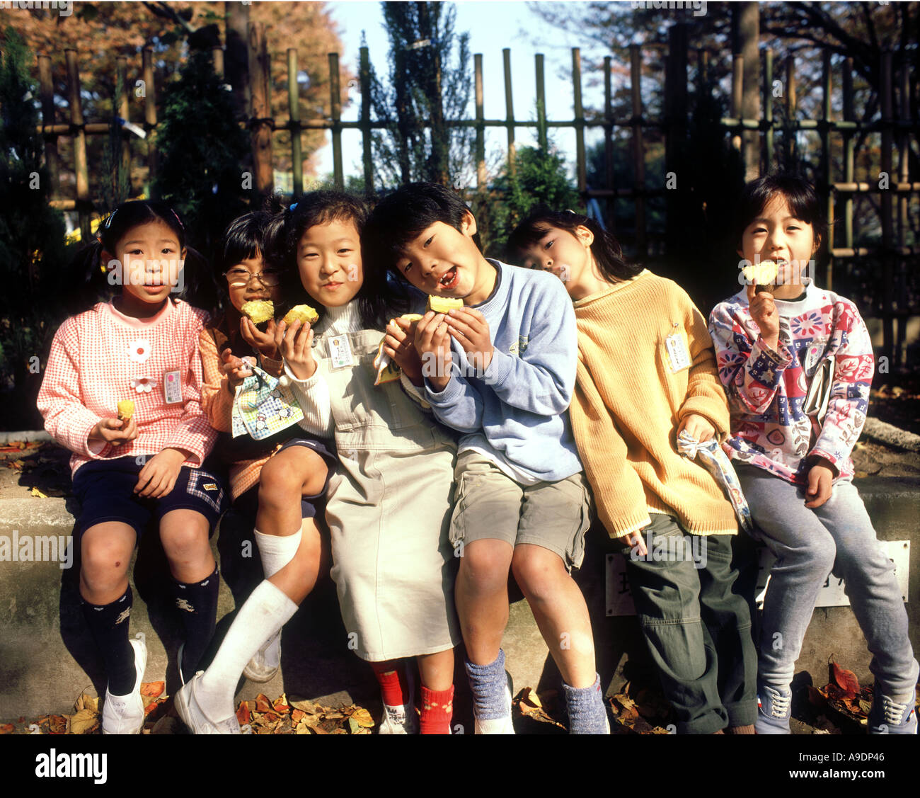Children eating baked sweet potatoes Tokyo Japan Stock Photo - Alamy