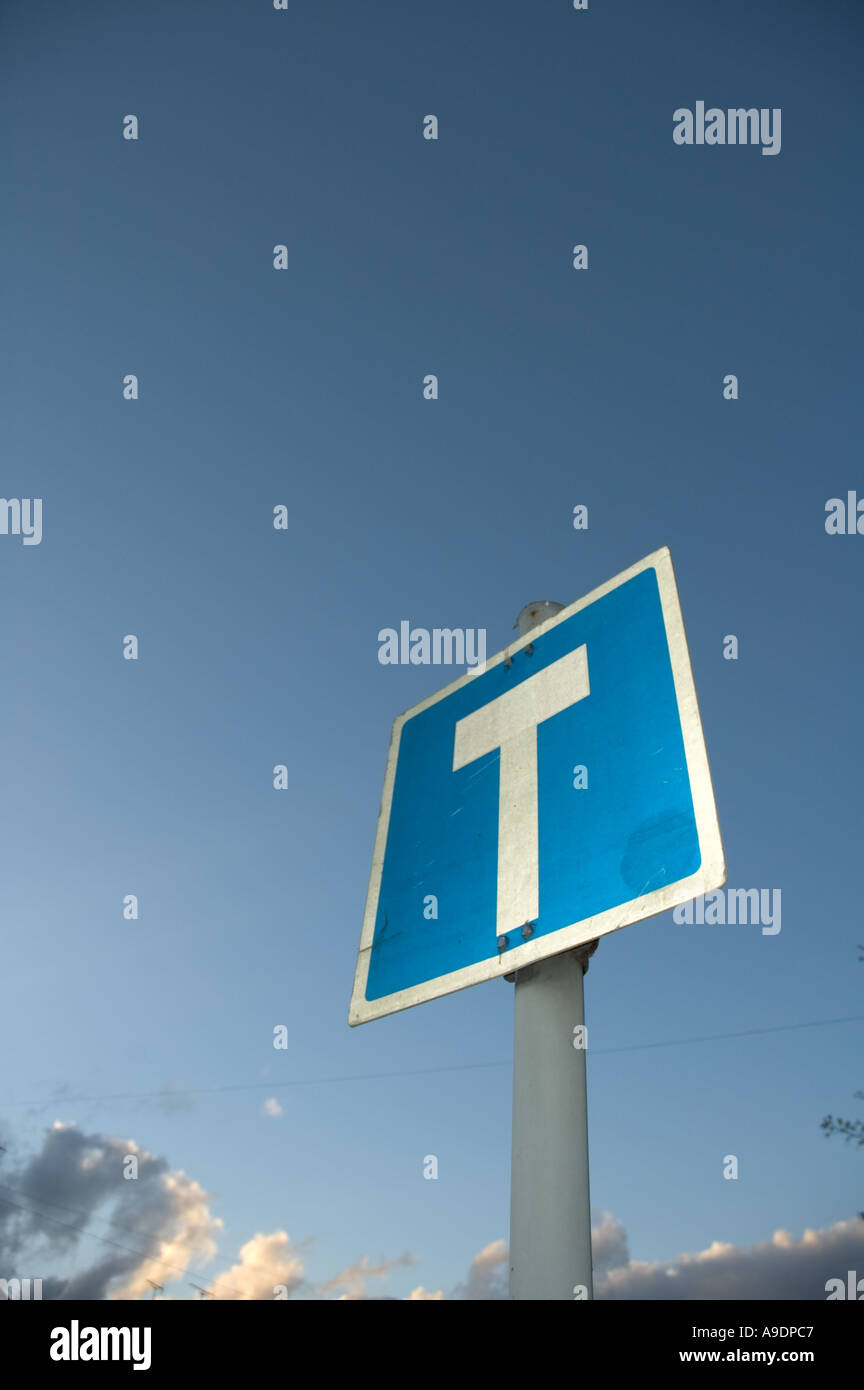 T junction sign with blue sky background in London England Stock Photo ...