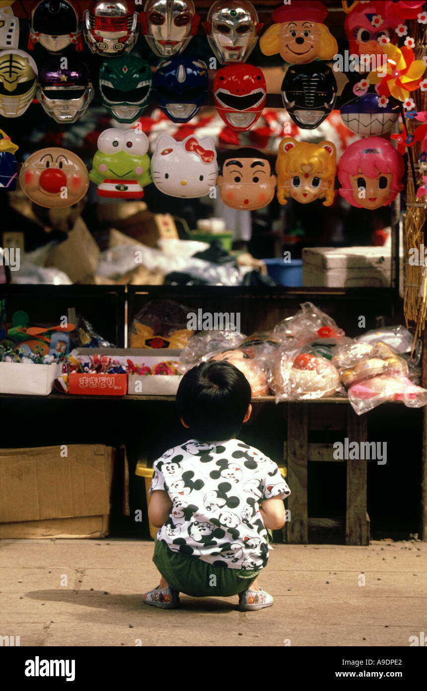 Boy at a mask seller s stall festival Japan Stock Photo - Alamy