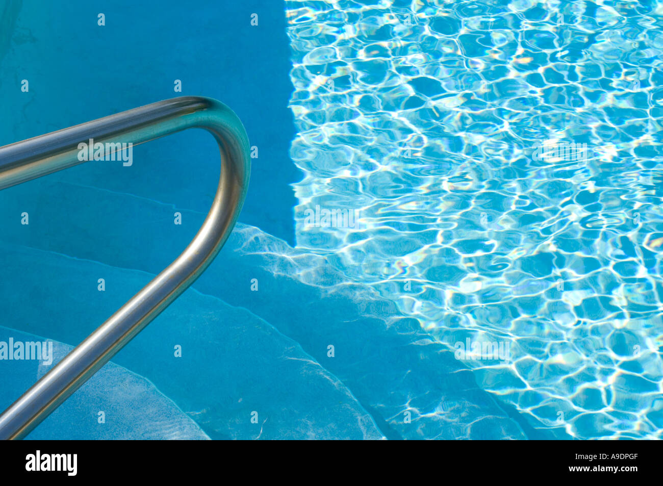 steps into tropical blue swimming pool Stock Photo - Alamy