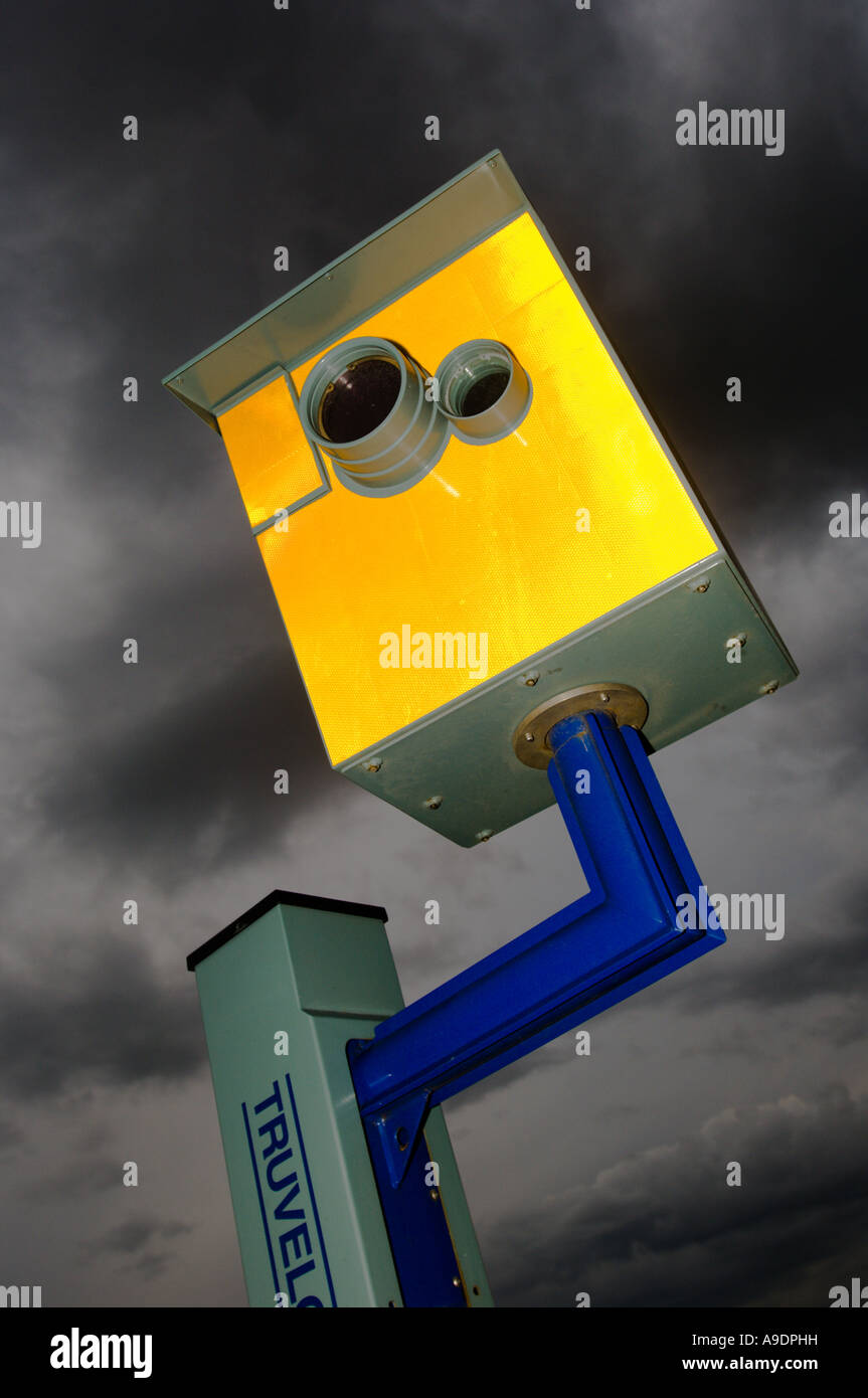 Speed camera on a UK roadside, seen against a dramatic grey sky Stock ...