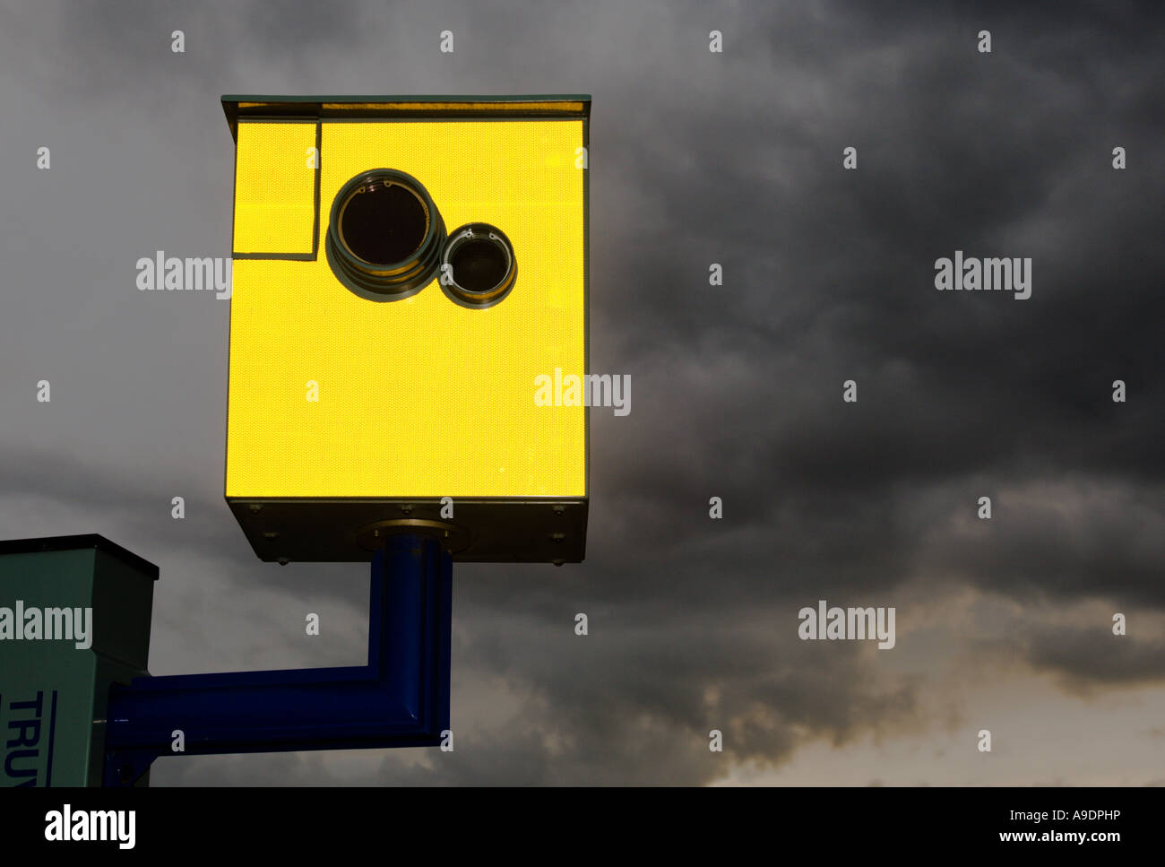 Speed camera on a UK roadside, seen against a dramatic grey sky Stock ...