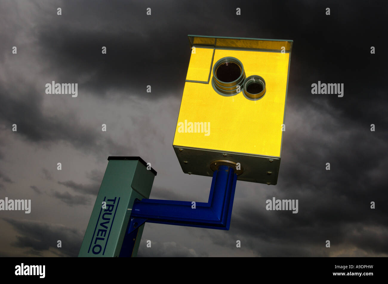 Speed camera on a UK roadside, seen against a dramatic grey sky Stock ...