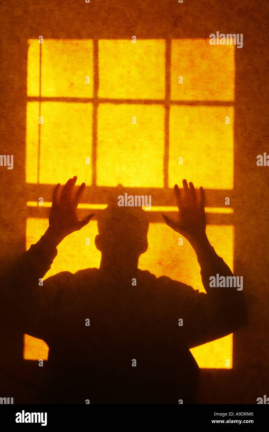 sihouette of man opening window Stock Photo - Alamy