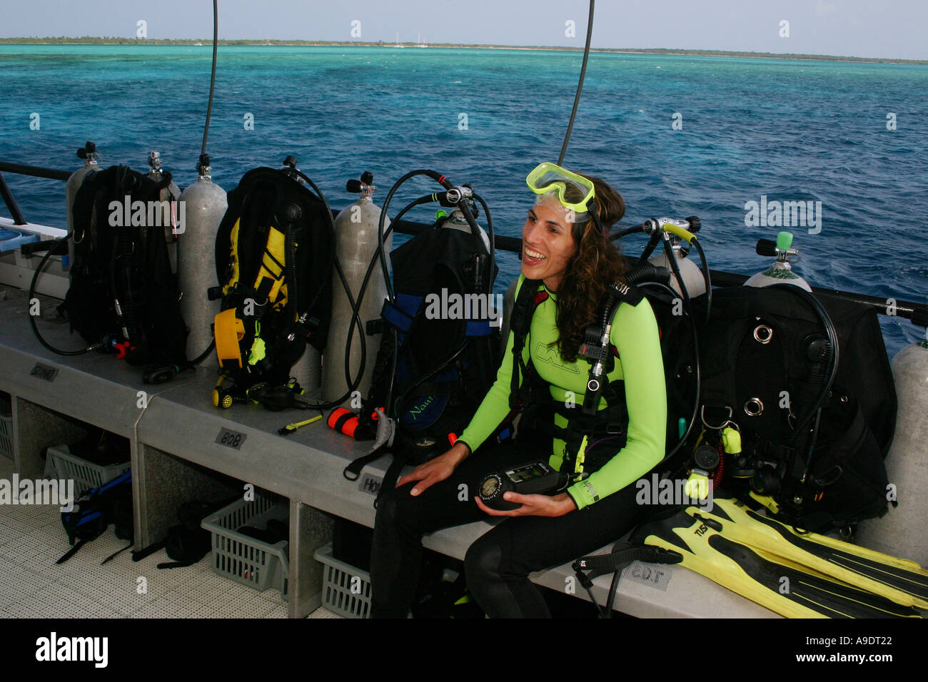 nr70585D SCUBA DIVER Model Released ON BOAT PREPARES EQUIPMENT Belize ...