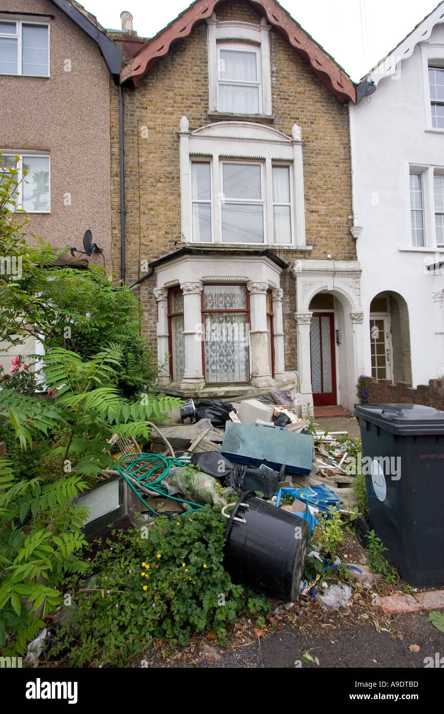 Front garden full of rubbish outside private residential housing ...