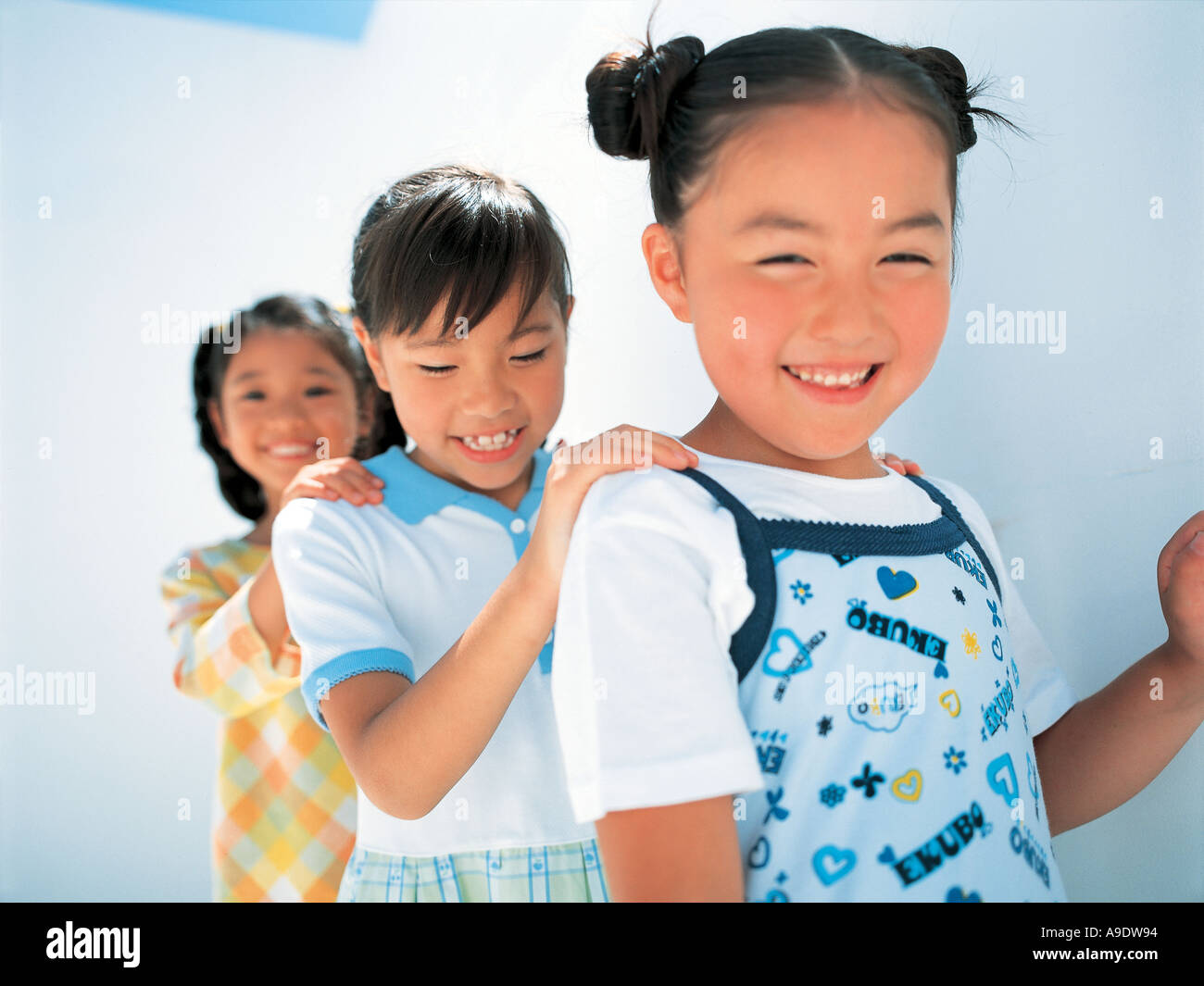 Three girls playing Stock Photo - Alamy