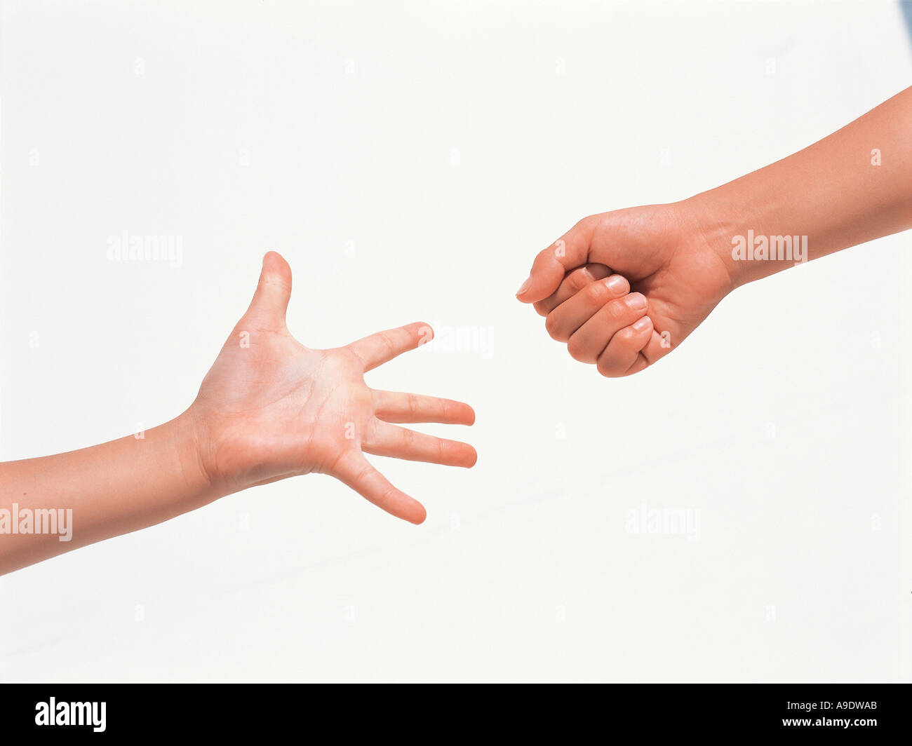 Kids playing rock paper scissors hi-res stock photography and images ...