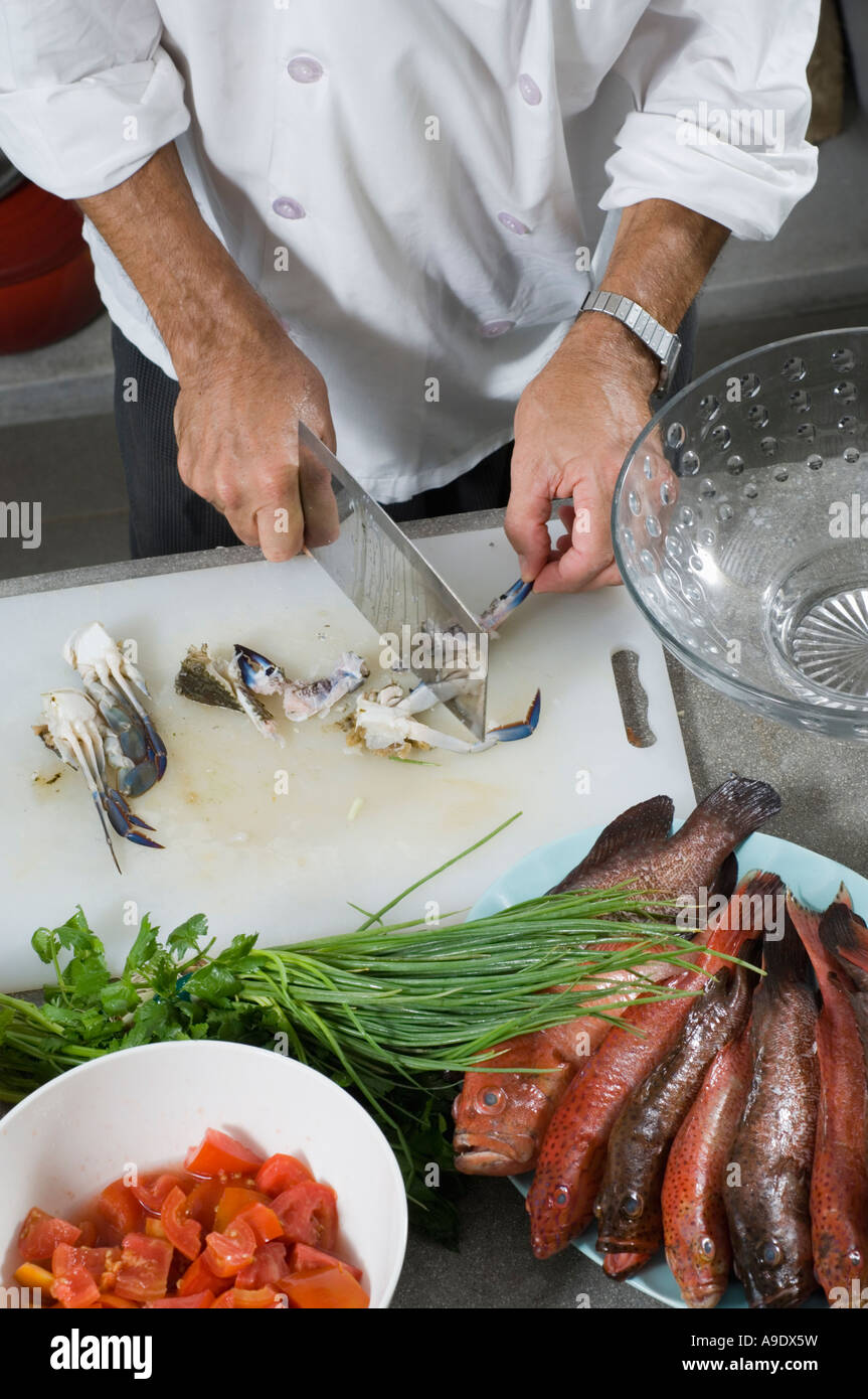 chef cutting crabs Stock Photo - Alamy