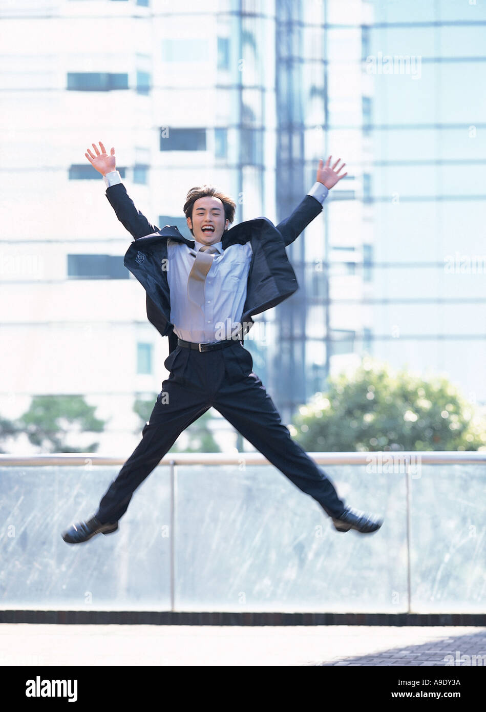 Business man suit jump outside hi-res stock photography and images - Alamy