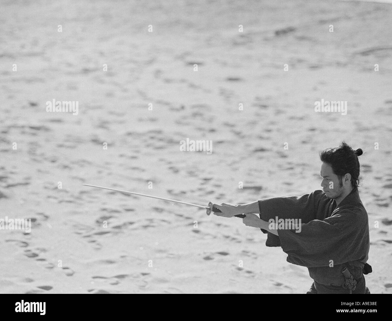 Samurai with raised sword hi-res stock photography and images - Alamy