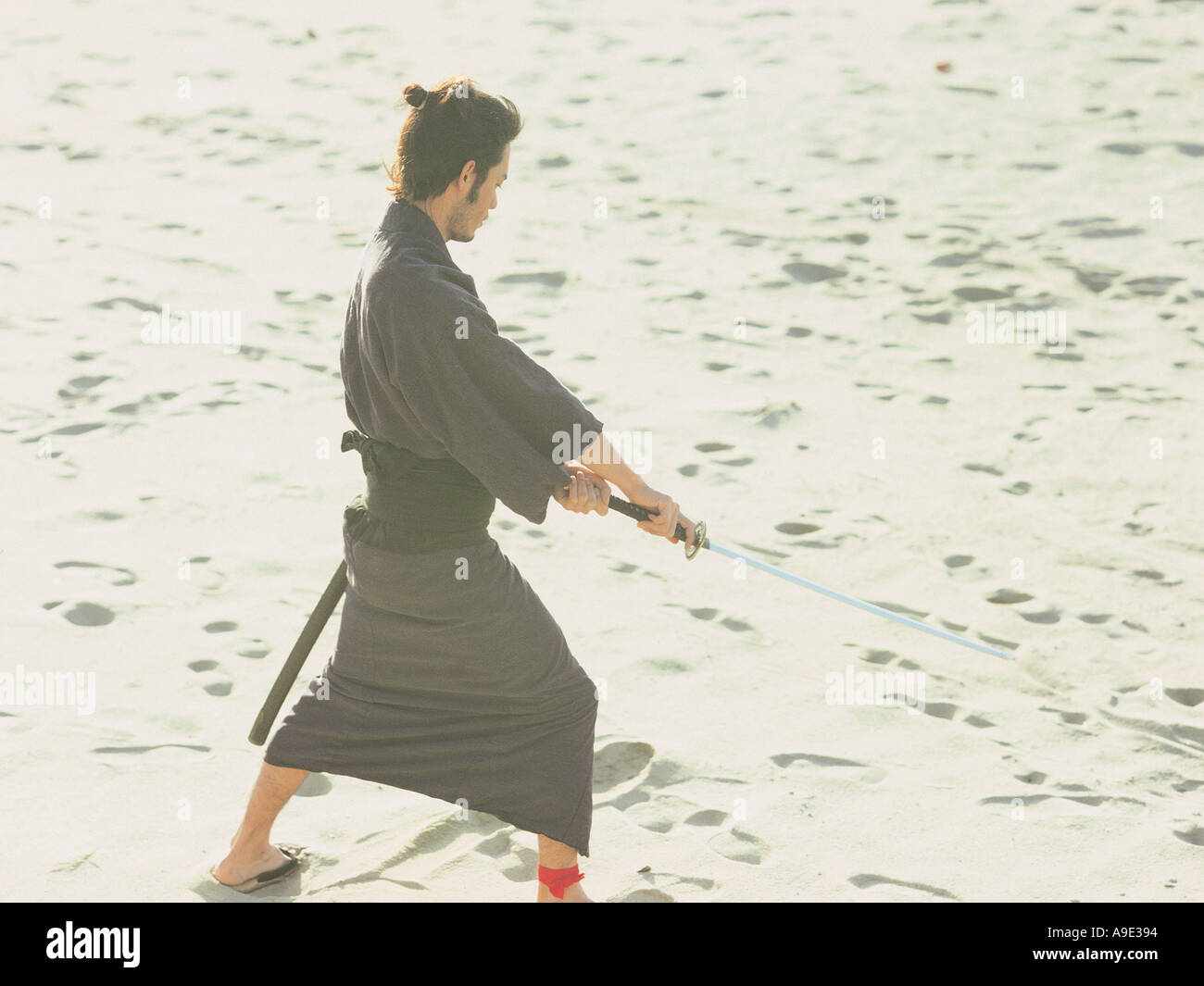 Samurai with raised sword hi-res stock photography and images - Alamy