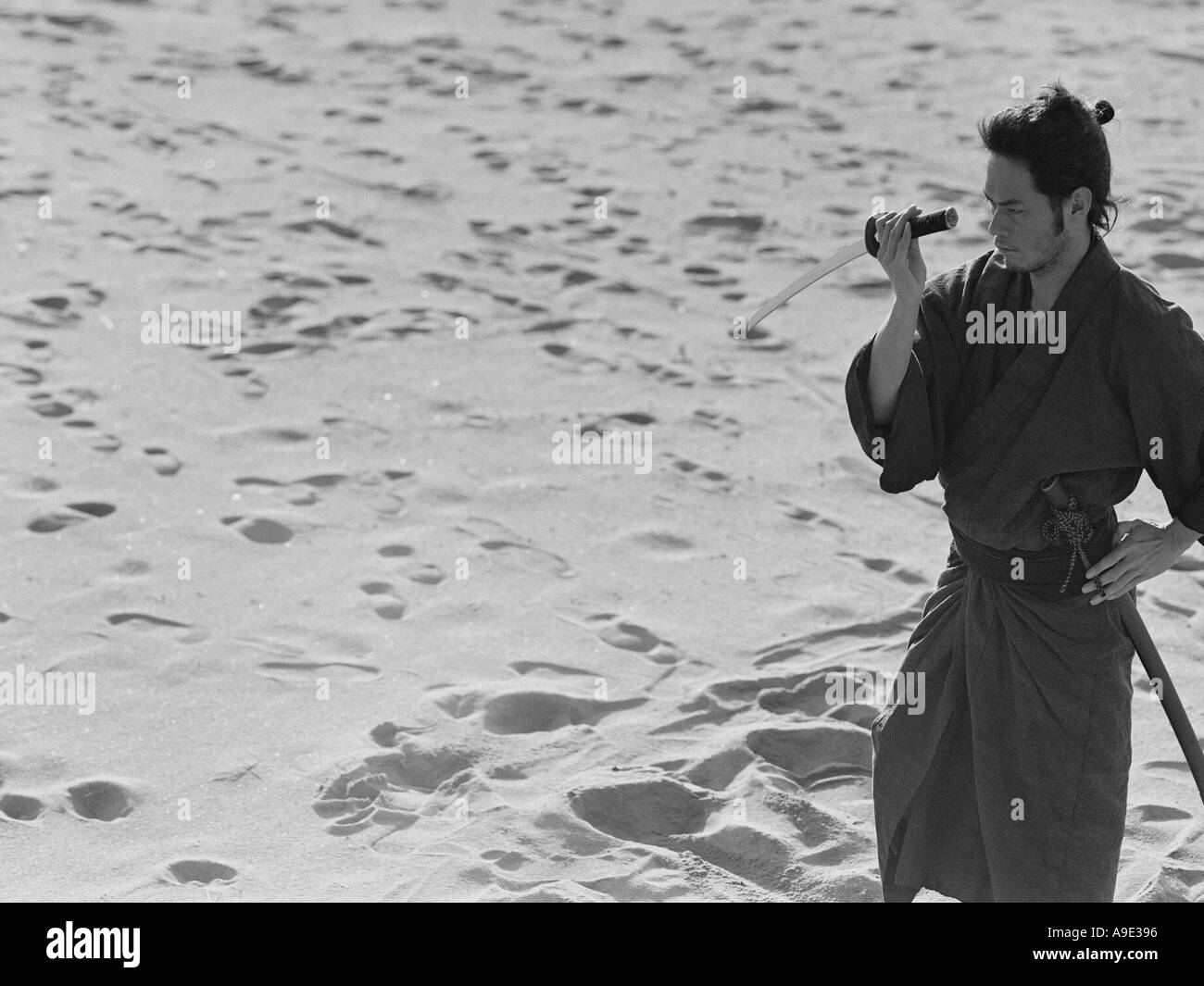Samurai with raised sword hi-res stock photography and images - Alamy