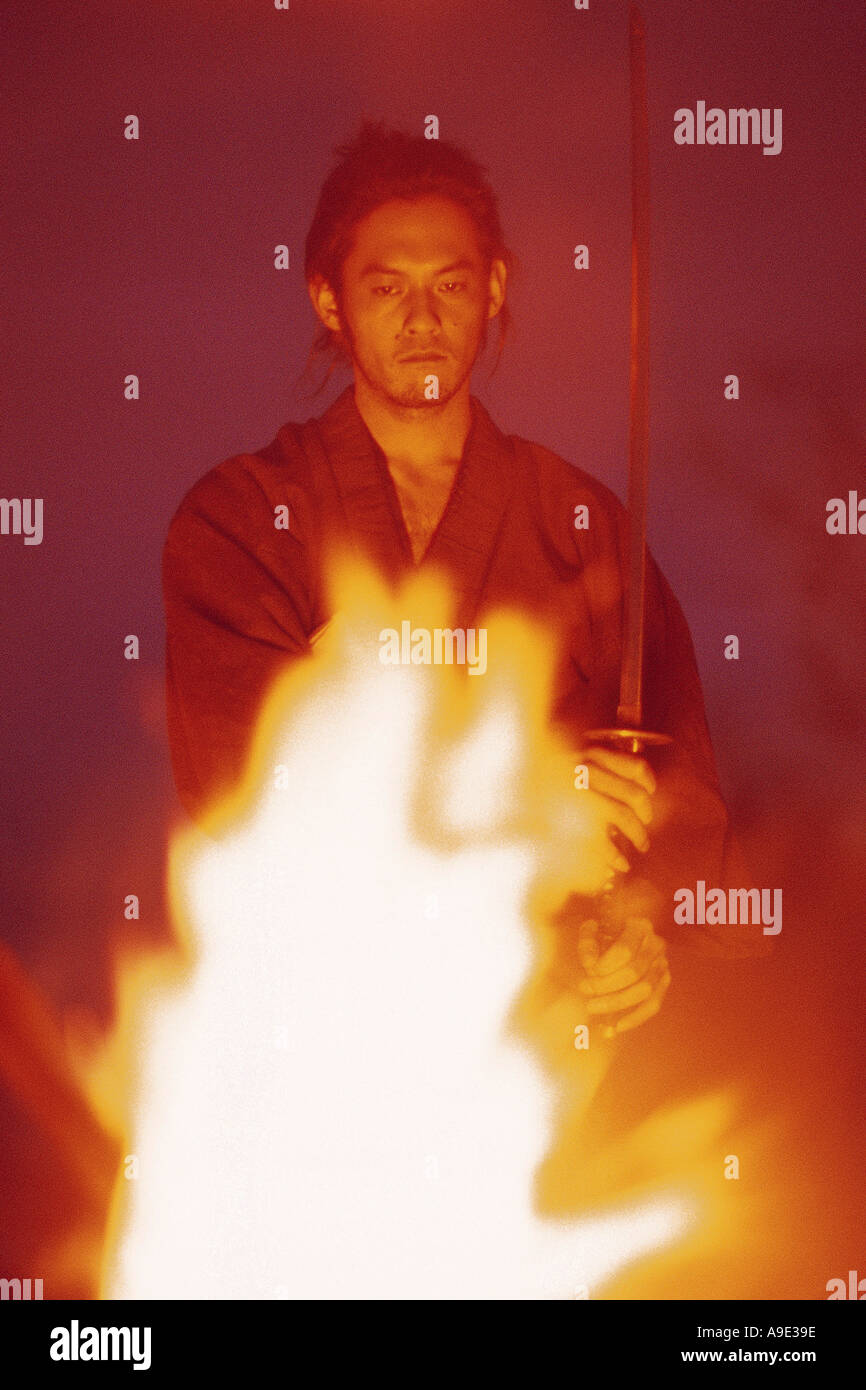 Samurai with raised sword hi-res stock photography and images - Alamy