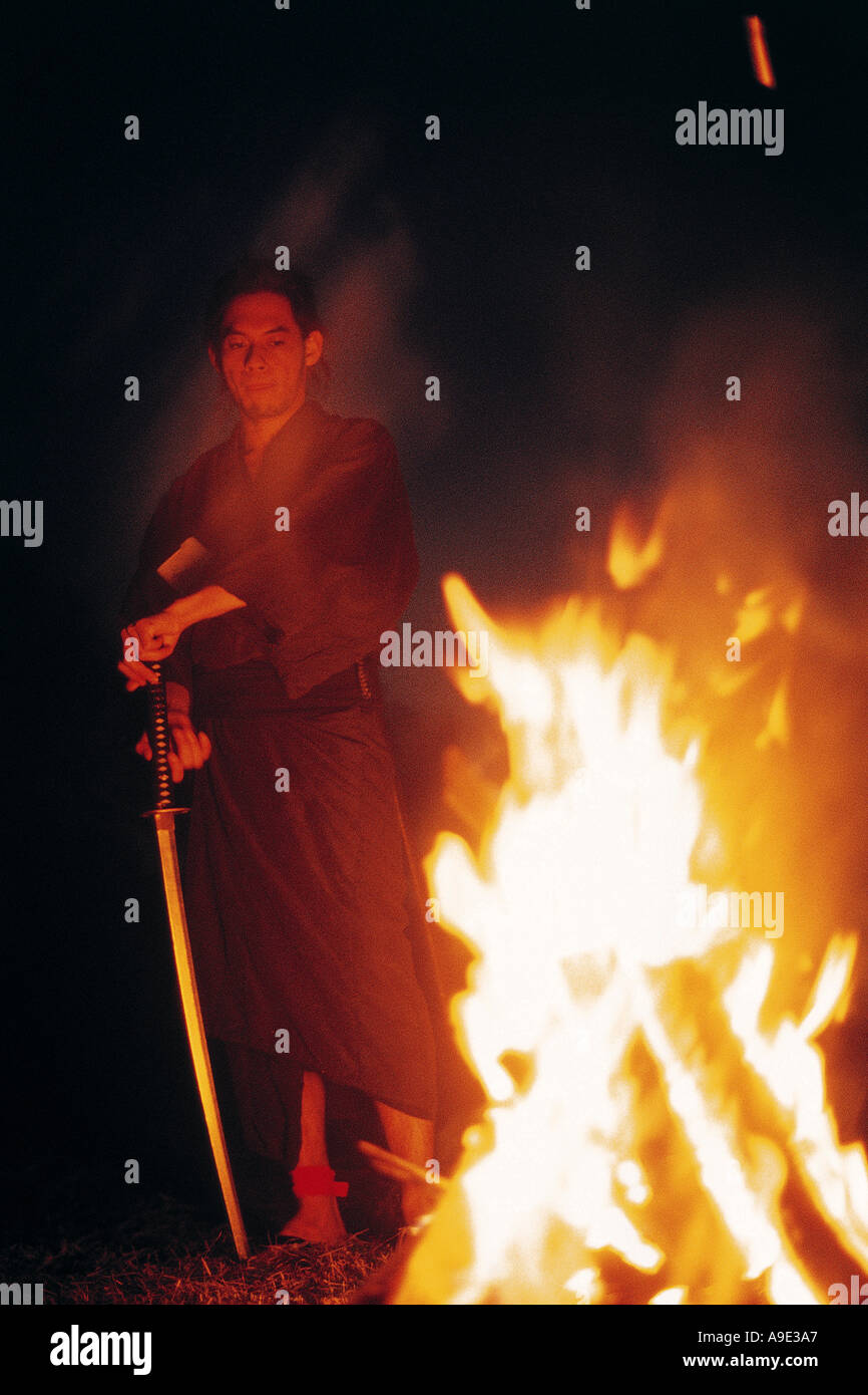 Samurai with raised sword hi-res stock photography and images - Alamy