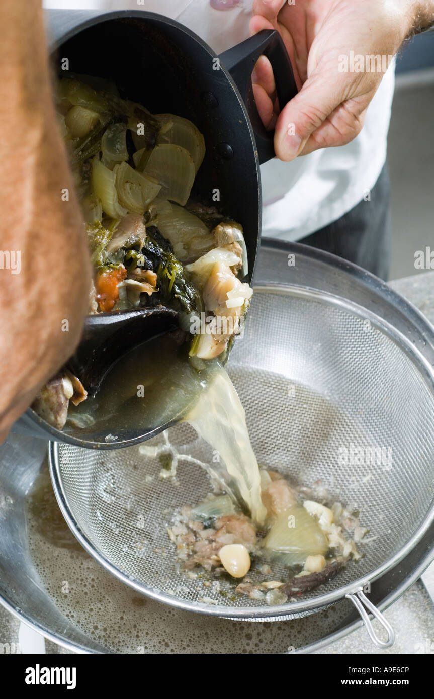 chef straining stock Stock Photo - Alamy