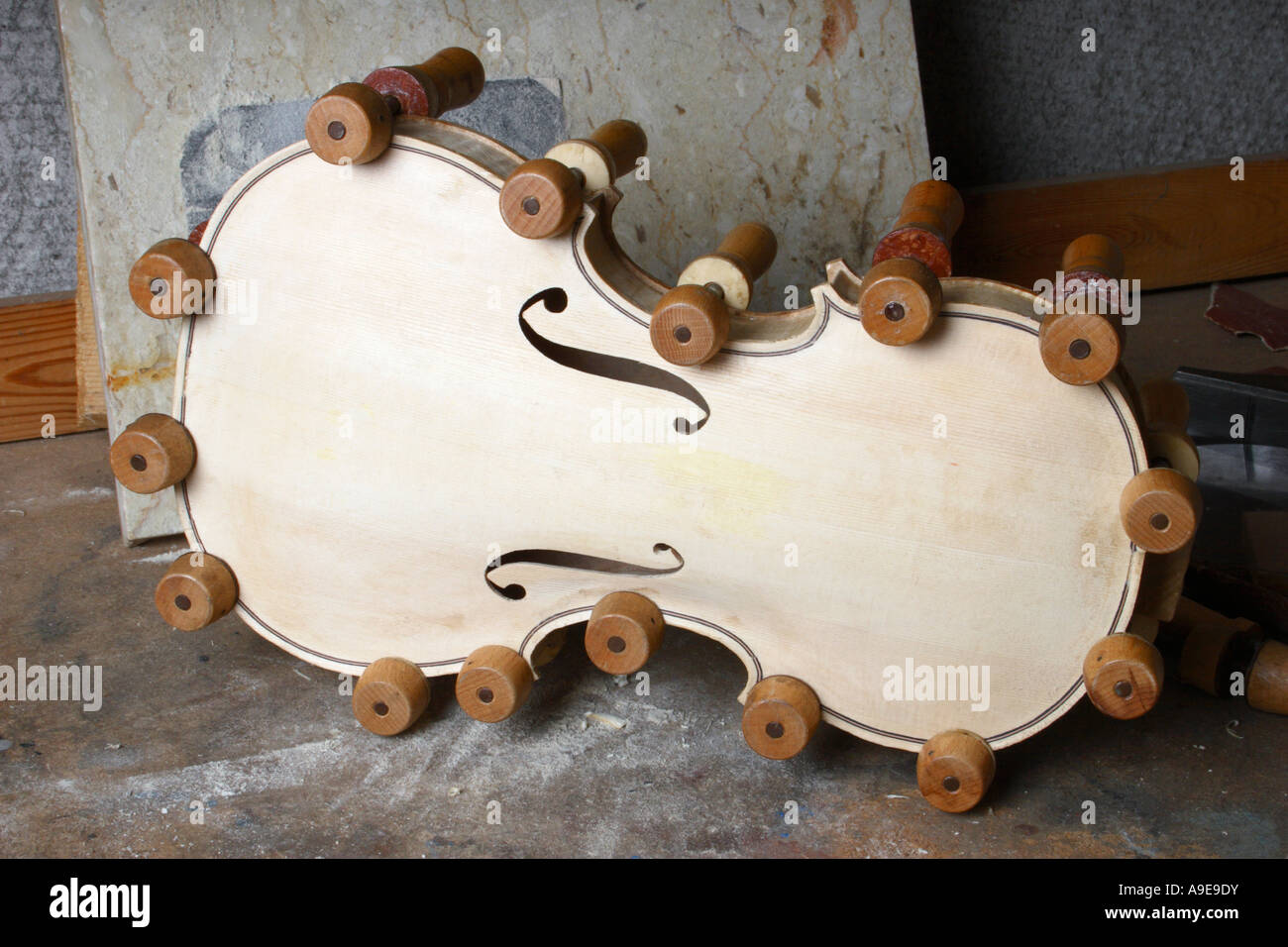 Violin body held together by clamps Stock Photo - Alamy