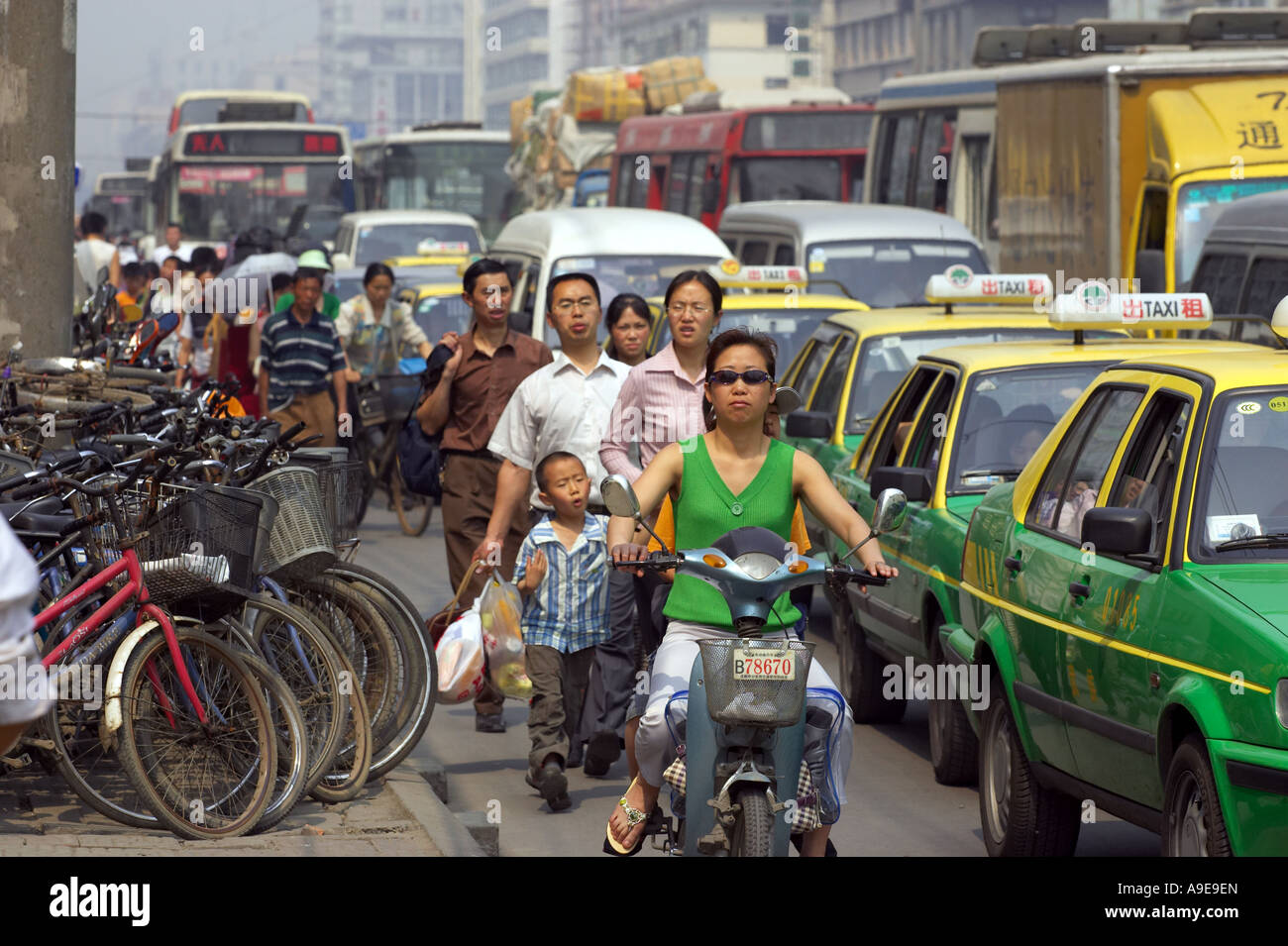 Travelers make their way through heavy traffic in Chengdu, China Stock ...