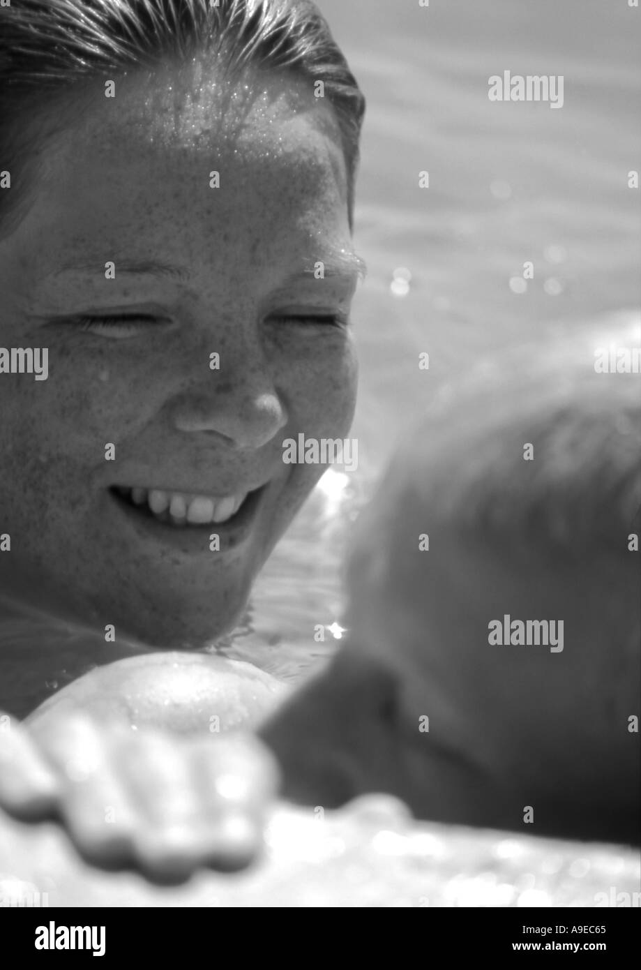 Woman smiling closeup at man Stock Photo - Alamy