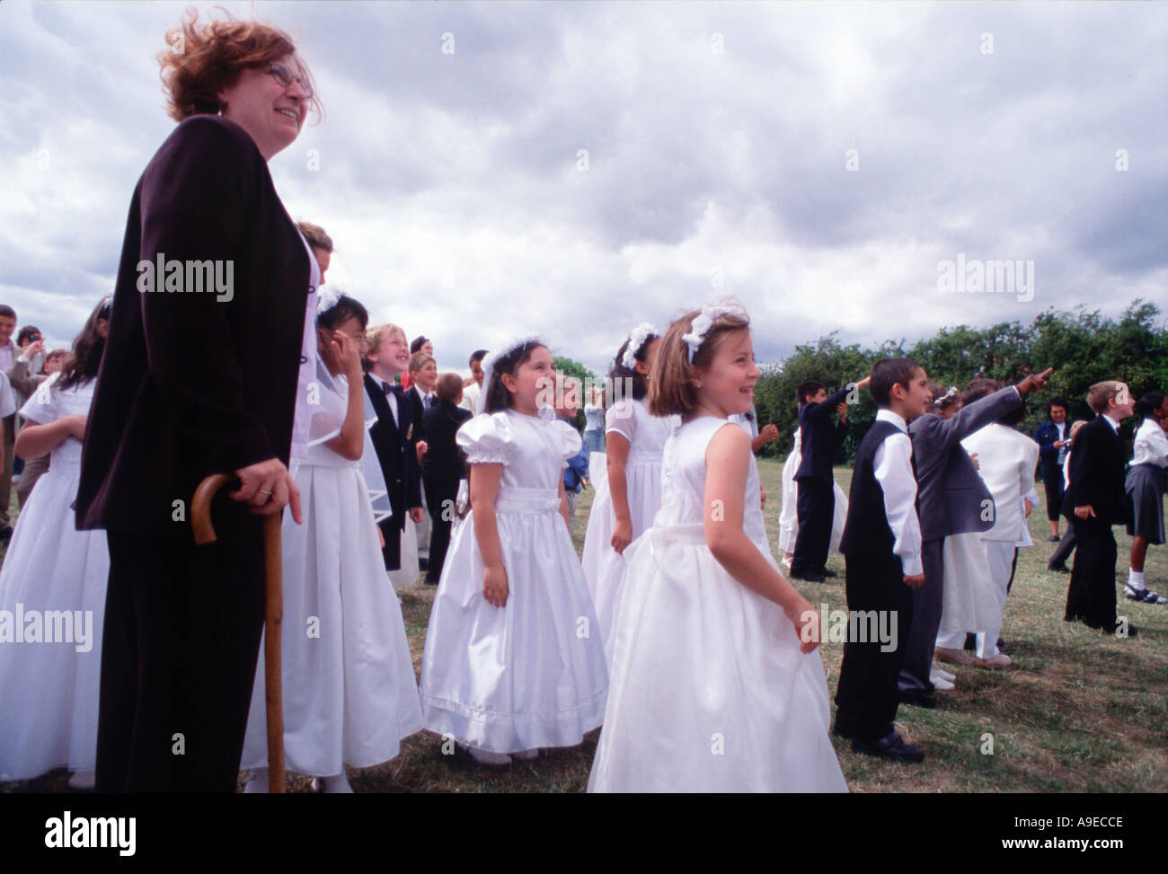 8 year old First Communion Children with Head Teacher watch balloons ...