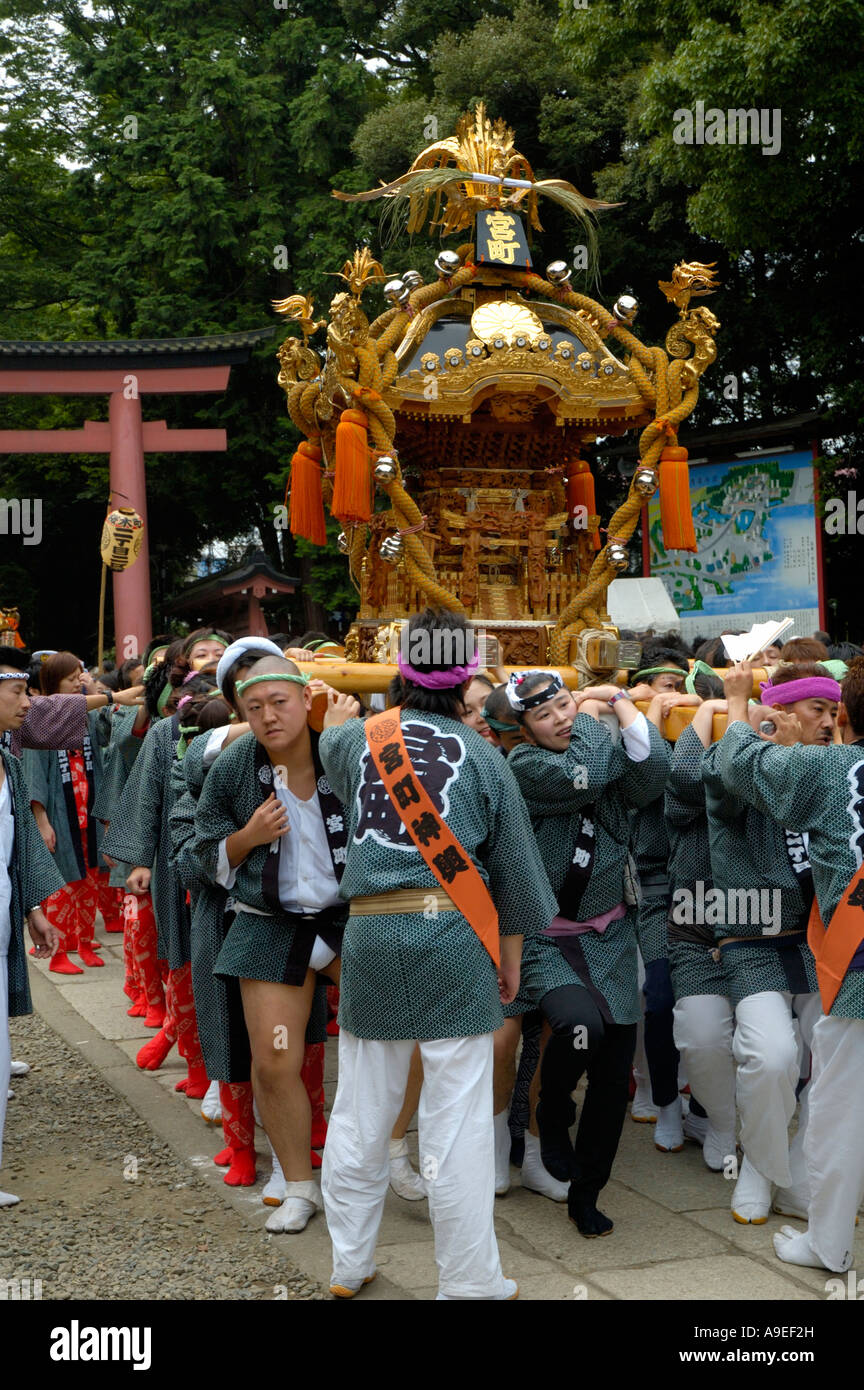 Carrying a mikoshi shrine at a local festival in Japan Stock Photo - Alamy