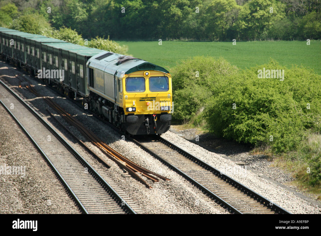 Goods train carrying freight containers hi-res stock photography and ...