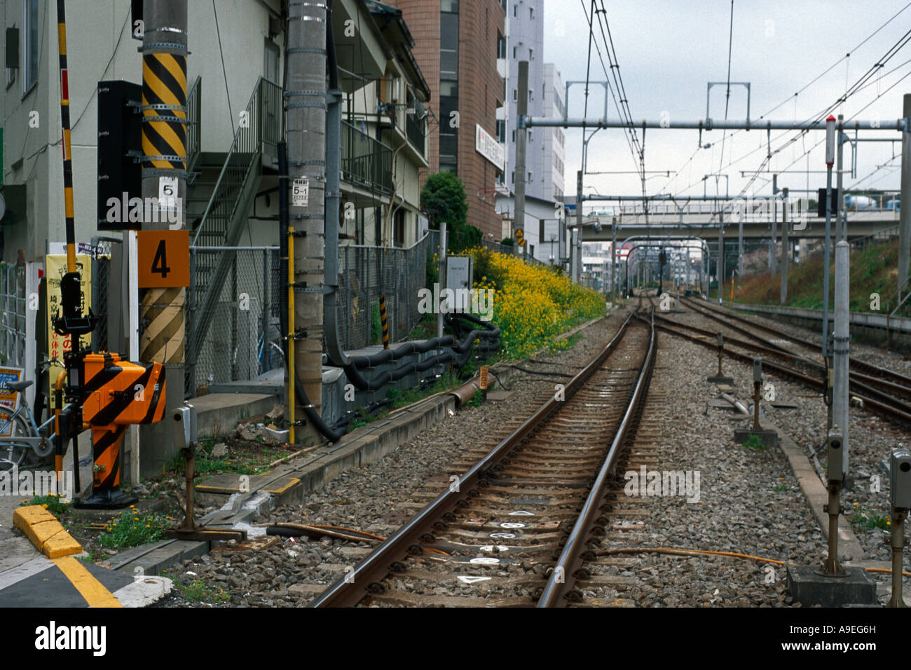 Level crossing in central Tokyo Stock Photo - Alamy