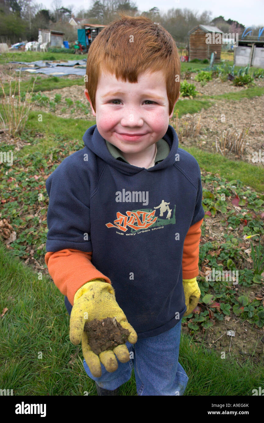 Child on allotment Stock Photo - Alamy