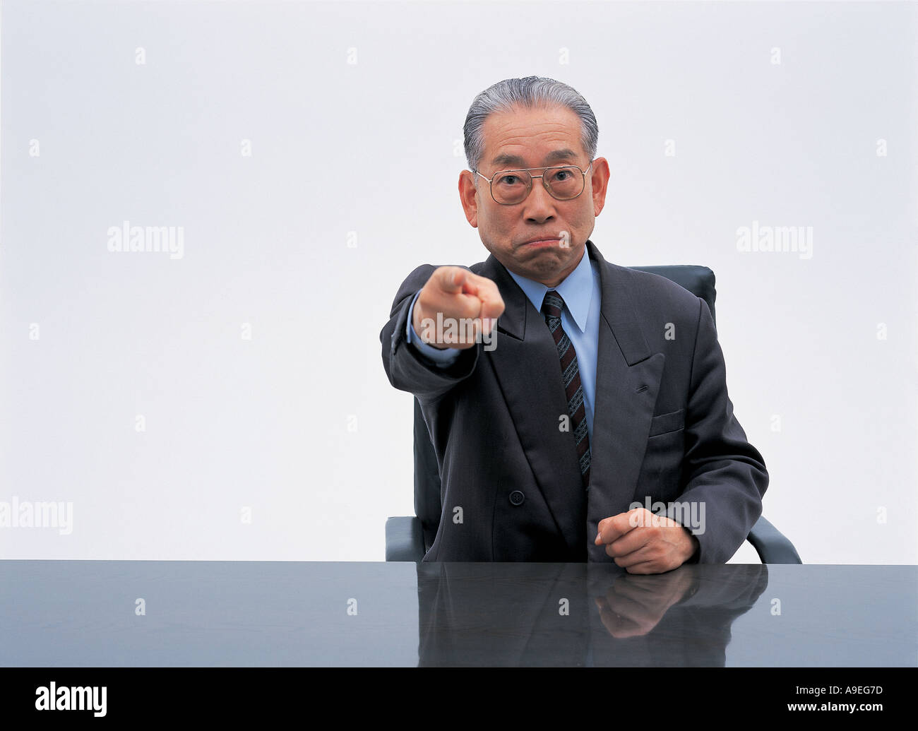 Angry asian businessman pointing finger hi-res stock photography and ...