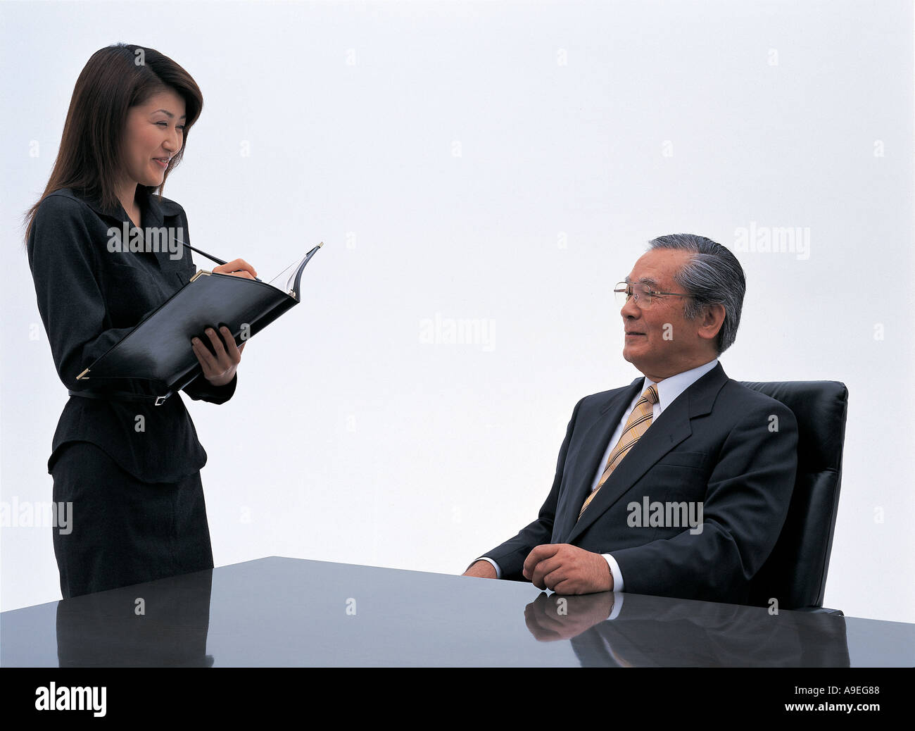 Executive and secretary Stock Photo - Alamy