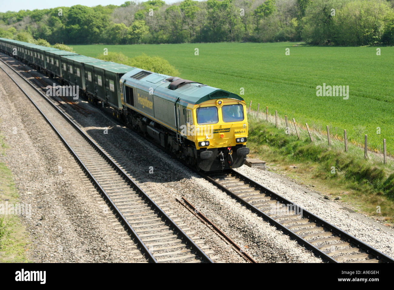 Goods train carrying freight containers hi-res stock photography and ...