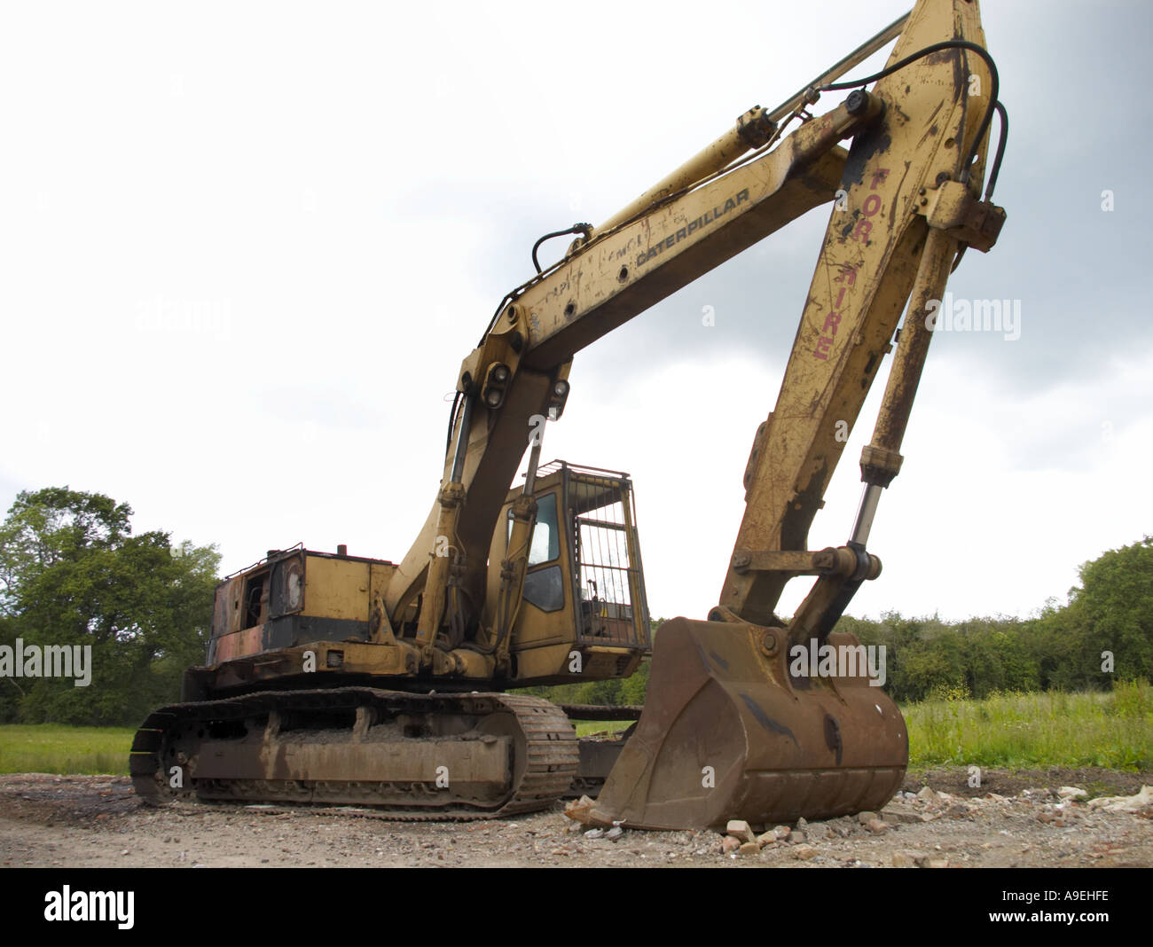 abandoned rusting road diggers in UK countryside Stock Photo - Alamy