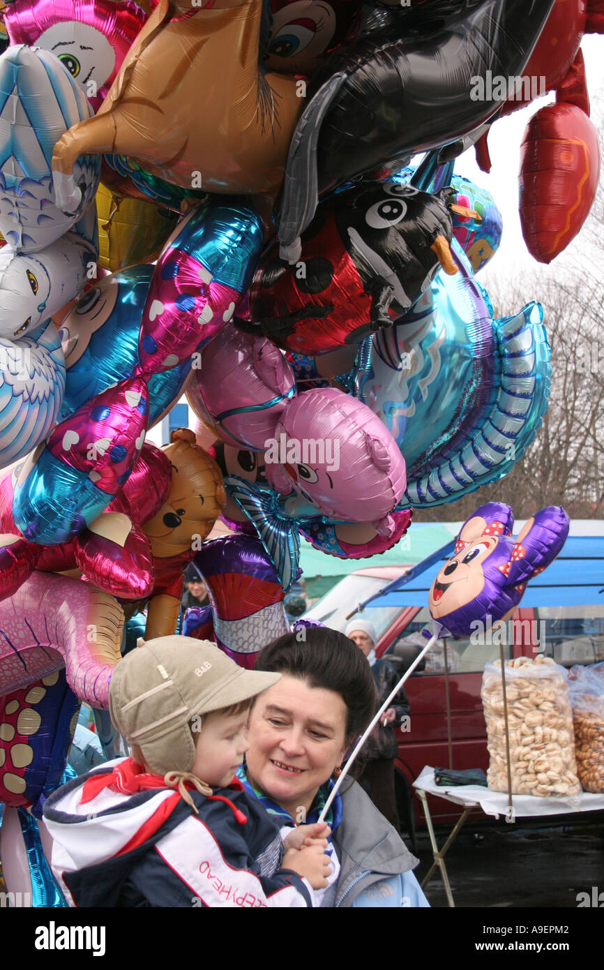 Child selling balloons hi-res stock photography and images - Alamy
