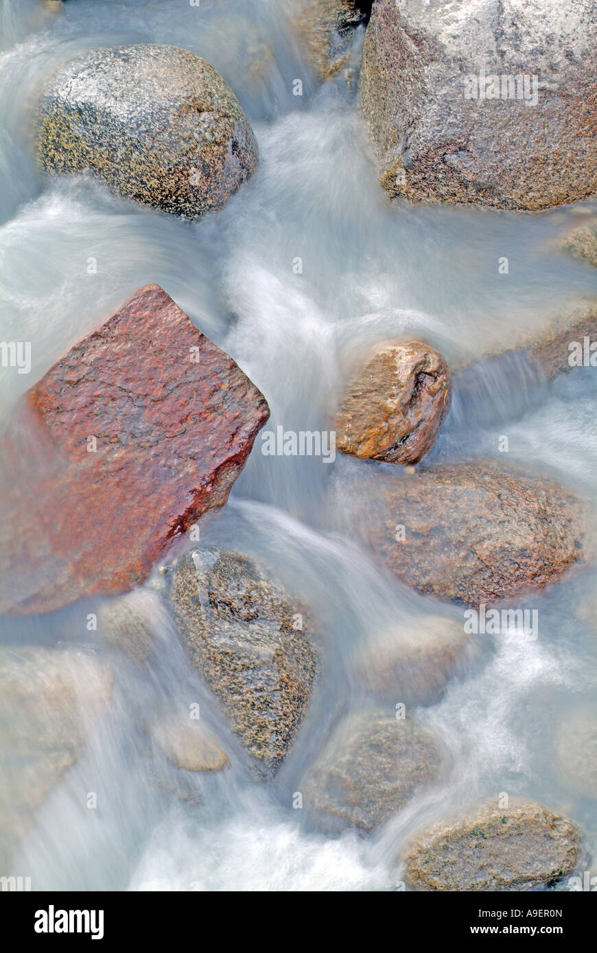 Water flowing over stones in mountain stream Stock Photo - Alamy